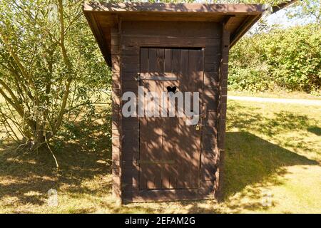 Old fashioned outside wooden toilet built in garden shed, Suffolk, UK ...