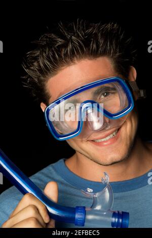A vertical shot of black diving mask with water drops Stock Photo - Alamy