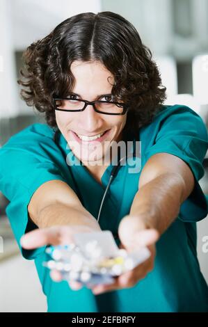 close up view of blister pack with pills isolated on pink Stock Photo ...