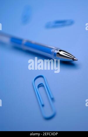 Selective focus of a pen, paper clips and notebook written with Things ...