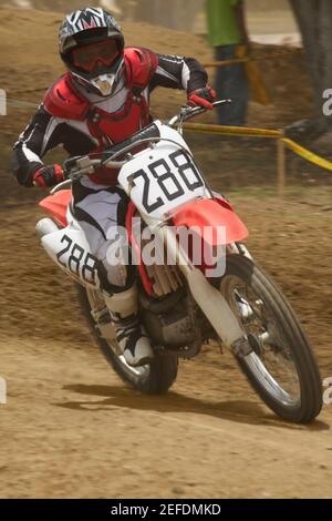 Motocross rider leaning into a turn Stock Photo - Alamy