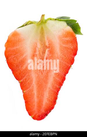 Different ripe strawberries and strawberry slices isolated on pink ...