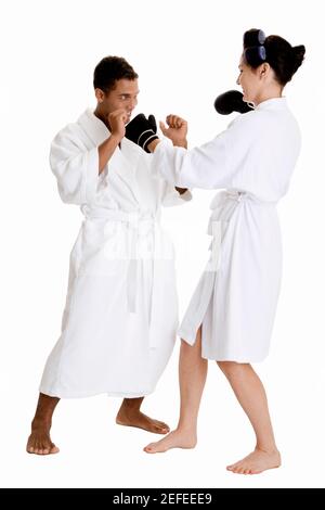 Side profile of a young couple sparring Stock Photo - Alamy