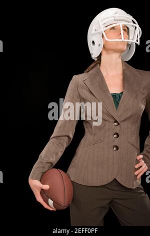 Woman businesswoman with american football Stock Photo - Alamy