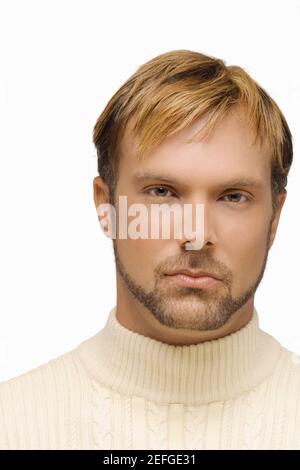 Serious middle-aged Latin man tennis player playing padel during ...