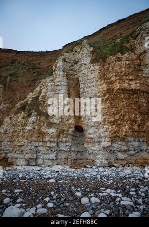Rock strata revealed in eroded coastal rocks. The diagonal strata seen ...