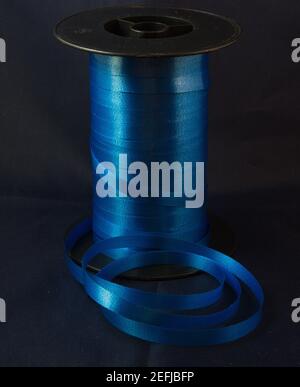 Glossy gift strings on plastic reels Stock Photo - Alamy