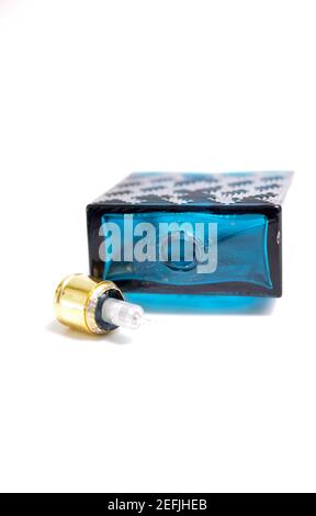 Broken perfume bottle on white background Stock Photo - Alamy