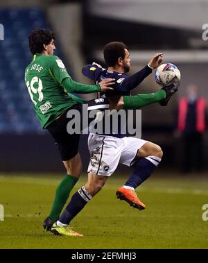 Mason Bennett of Millwall and Mikel San José of Birmingham City compete ...