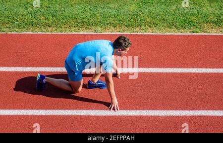 Runner ready to go. Athlete runner prepare to race at stadium. Running ...