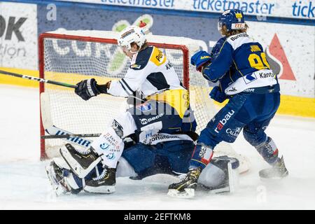 Sven Jung #90 (HC Davos) is fouled by Daniel Vozenilek #96 (EV Zug ...
