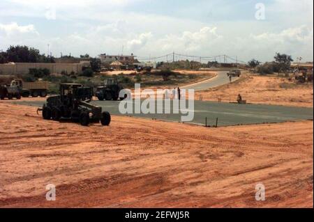 Seabees of Amphibious Construction Battalion One (ACB-1) use a landing ...
