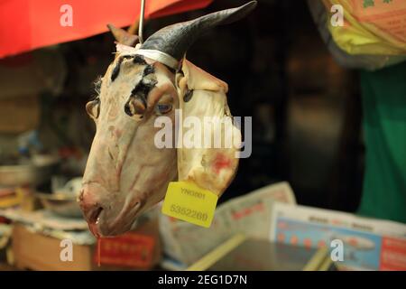 butchery, the goat head in hong kong market Stock Photo - Alamy