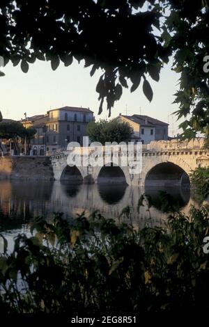 the Ponte di Tiberio in th old town of Rimini in Emilia-Romagna in ...