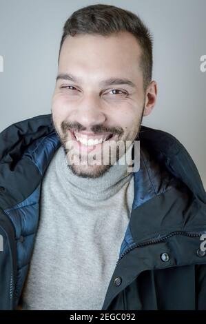 Young man laughing during conversation with his colleague Stock Photo ...