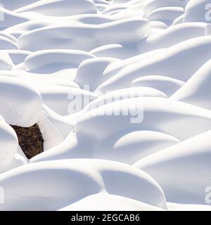 Abstract snow shapes on rocks Stock Photo - Alamy