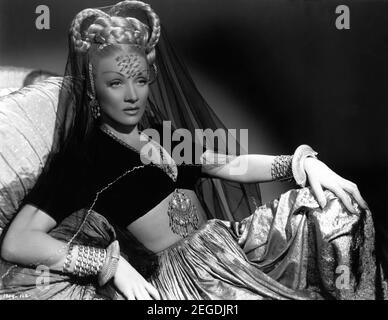 MARLENE DIETRICH and Costume Supervisor IRENE on set candid during ...