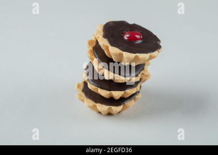 Tartalettes with chocolate ganache and red cherry Stock Photo - Alamy