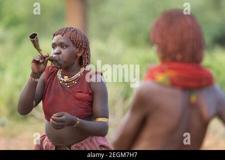 Women from the Banna tribe dancing before a bull jumping ceremony. The ...