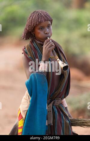 Women from the Banna tribe dancing before a bull jumping ceremony. The ...