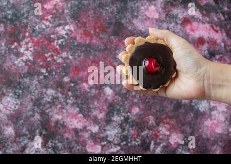 Tartalettes with chocolate ganache and red cherry Stock Photo - Alamy