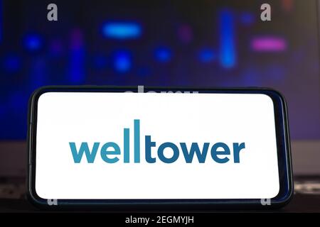 In this photo illustration, the Welltower logo is seen displayed on a ...