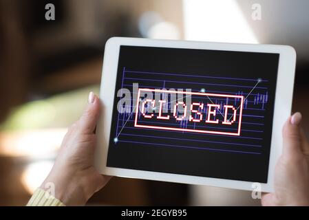 Tablet screen displaying a closed stock market concept Stock Photo - Alamy