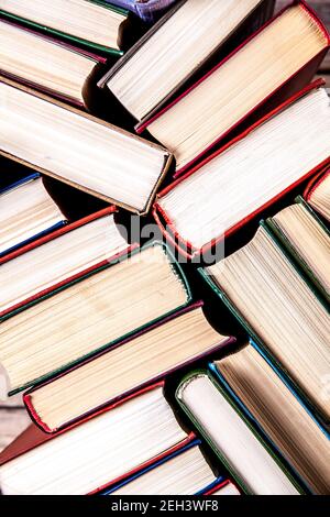 used hardback books or text books seen from above on wooden table Stock ...