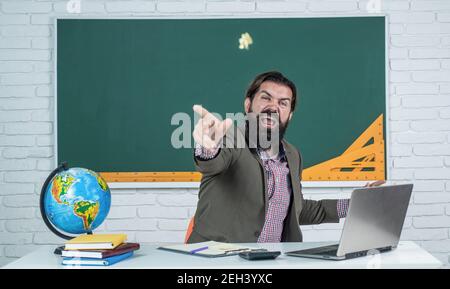 angry school teacher throwing book Stock Photo - Alamy