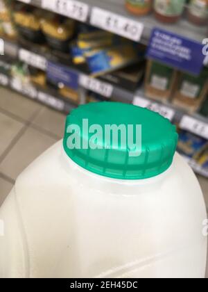 Small green top milk carton and milk Stock Photo - Alamy