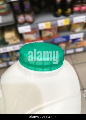 Small green top milk carton and milk Stock Photo - Alamy