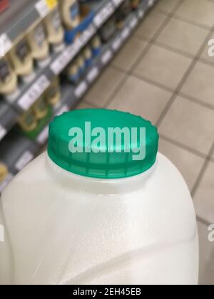 Small green top milk carton and milk Stock Photo - Alamy