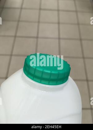 Small green top milk carton and milk Stock Photo - Alamy