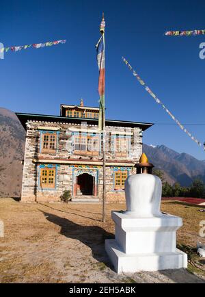 Buddhist monastery or gompa in Kharikhola village with prayer flafs ...