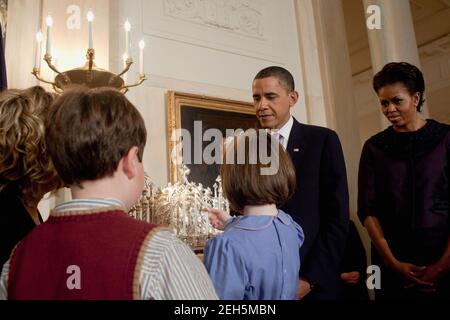 President Barack Obama and guests observe the inauguration parade from ...