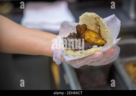 Chef making a delicious Arepa, Venezuelan traditional cuisine Stock ...
