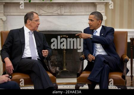 Russian Foreign Minister Sergey Lavrov enters a hall for his talks with ...