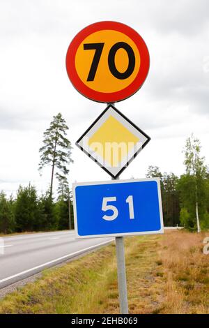 Road signs of speed limit 70 and pedestrian crossing Stock Photo - Alamy