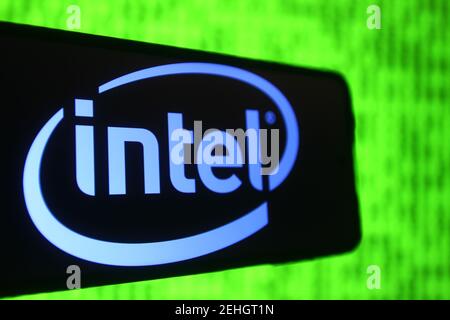 In this photo illustration, the Intel logo seen displayed on a ...