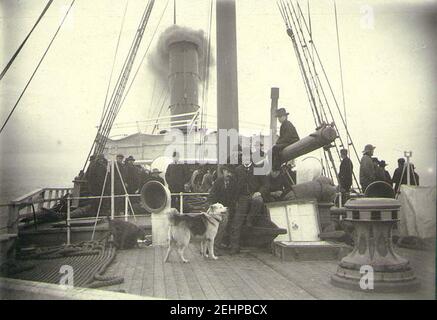 Passengers assembled on the deck of an unidentified steamer, probably ...