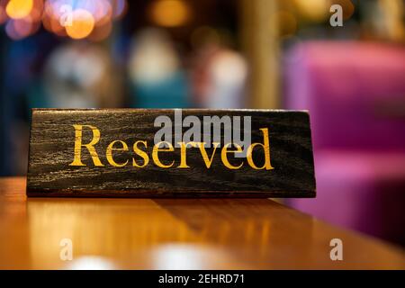 Plaque with the inscription Reserved on the restaurant table Stock ...