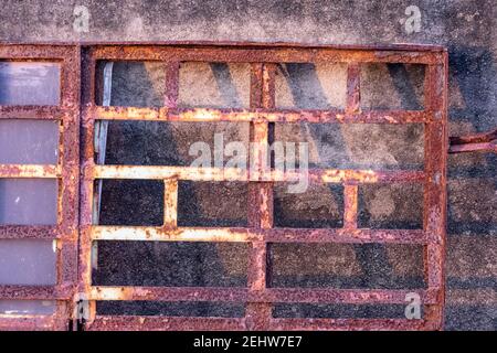 An old Industrial iron window frame rusting with broken glass Stock ...