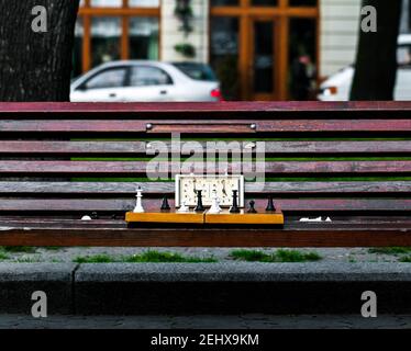 A chess board on the wooden bench Stock Photo - Alamy