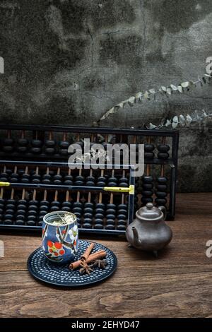 Beautiful old Vintage wooden abacus on a red wood table. Green wall ...