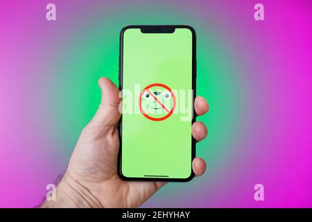 The Gab frog logo is seen with a prohibited sign on an iPhone 11 Pro ...