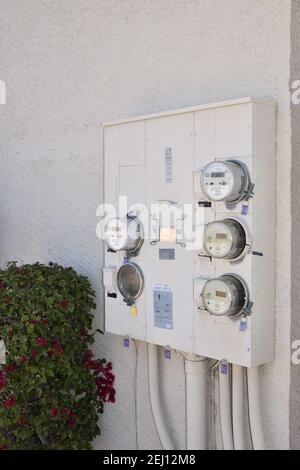 Electric power meters to apartments on the outside wall Stock Photo - Alamy