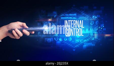 hand holding wireless peripheral with INTERNAL CONTROL inscription ...