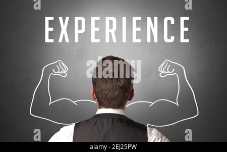 Rear view of a businessman with EXPERIENCE inscription, powerfull ...