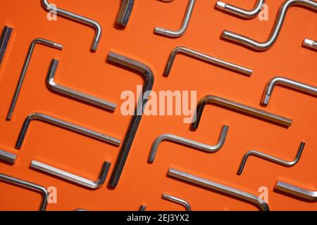 Allen keys on a orange table Stock Photo - Alamy