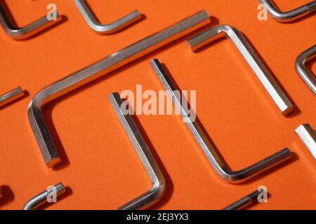 Allen keys on a orange table Stock Photo - Alamy